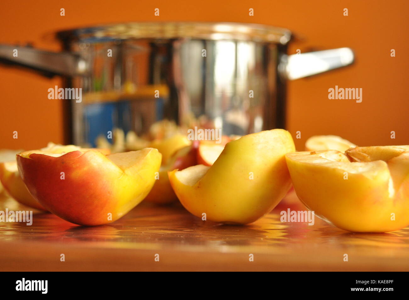 Sliced apples compote. Pot for preparing a beverage Stock Photo - Alamy