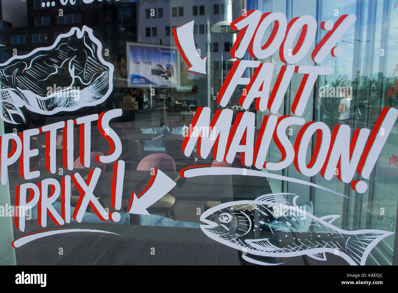 A poster on a restaurant's shop window promotes homemade food, Paris ...