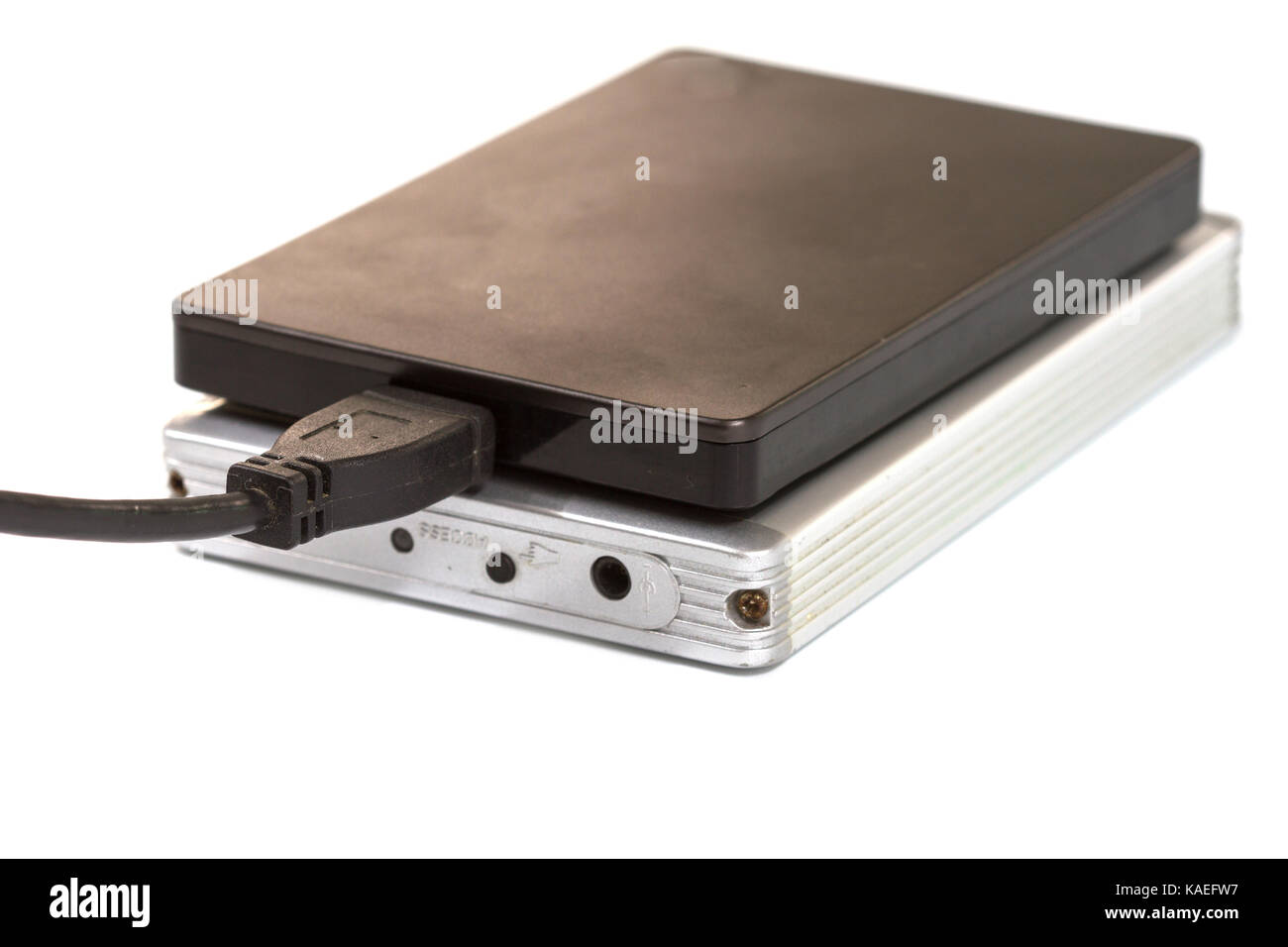 External hard drive with usb cable on white Stock Photo - Alamy