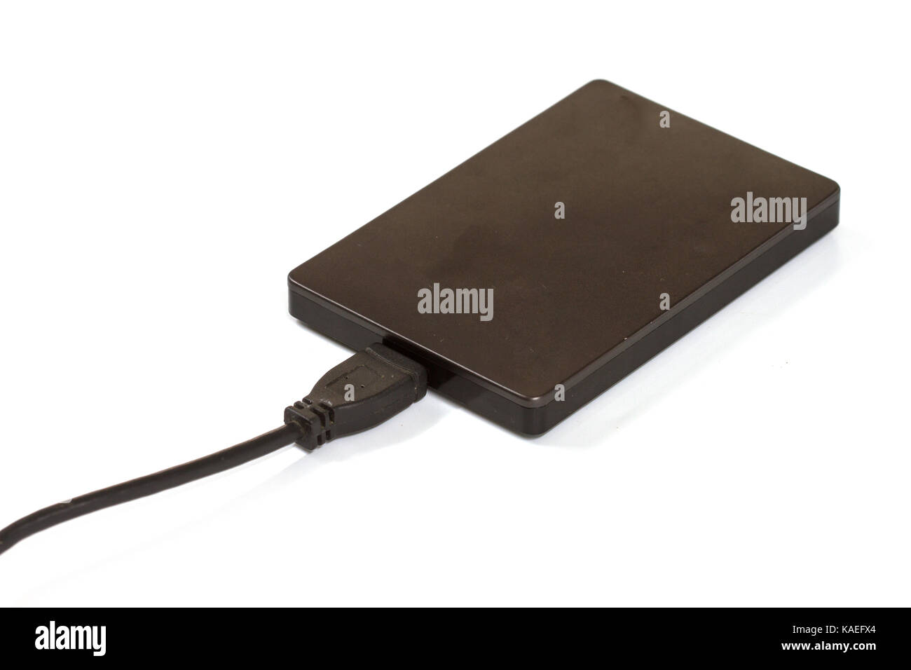 External hard drive with usb cable on white Stock Photo - Alamy