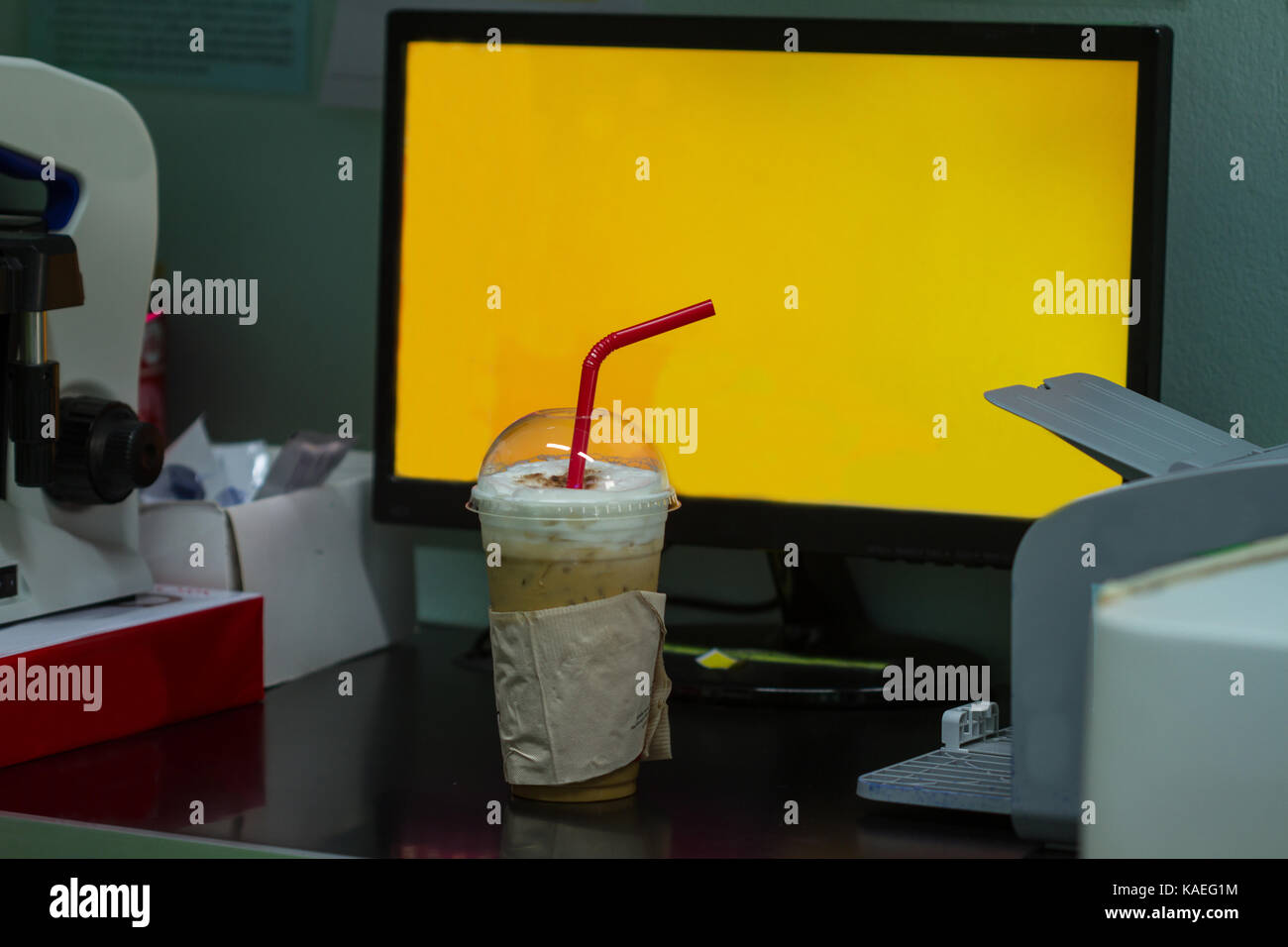 Close up iced coffee on table in office background Stock Photo - Alamy