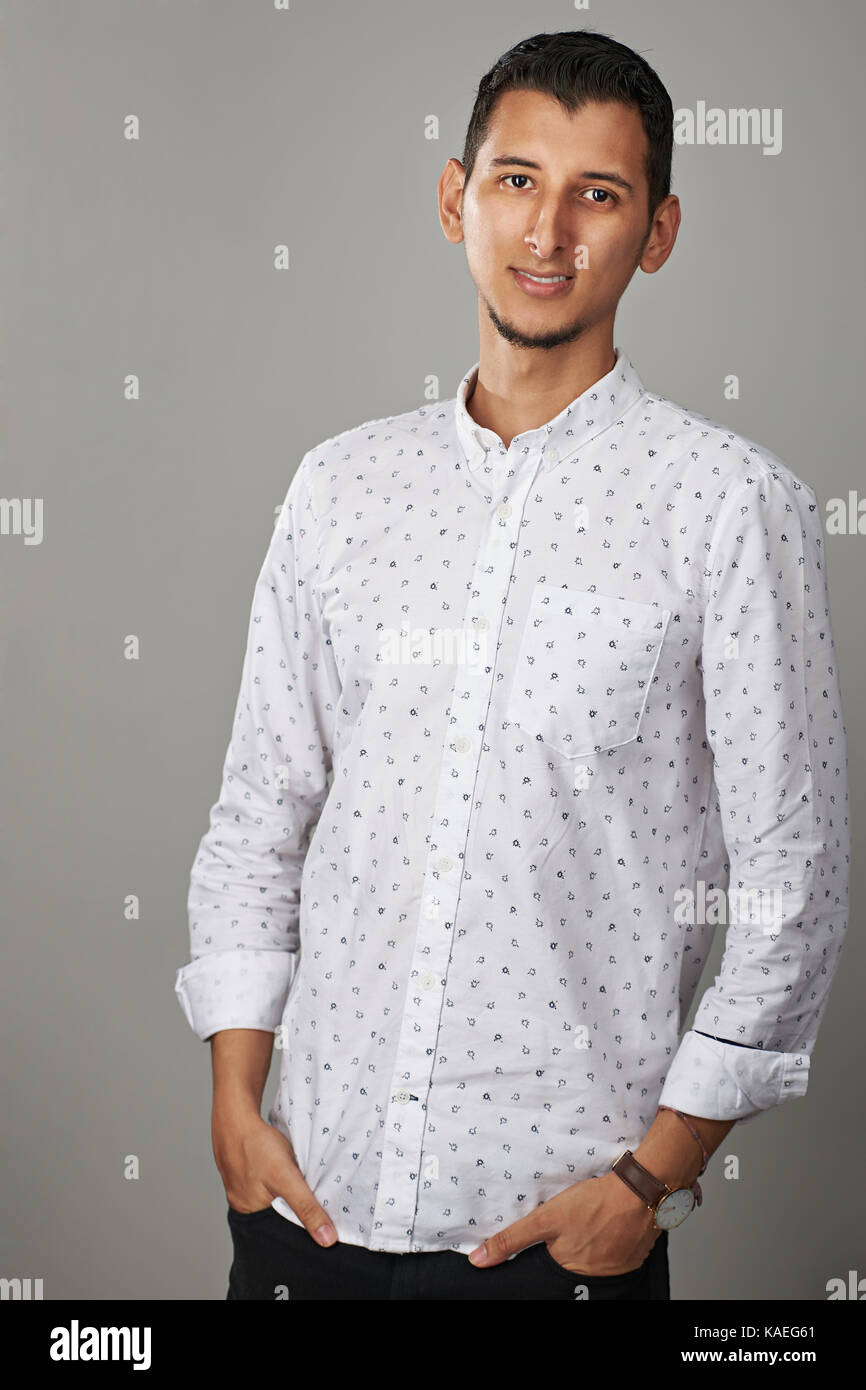 One young arab man standing in studio light Stock Photo - Alamy