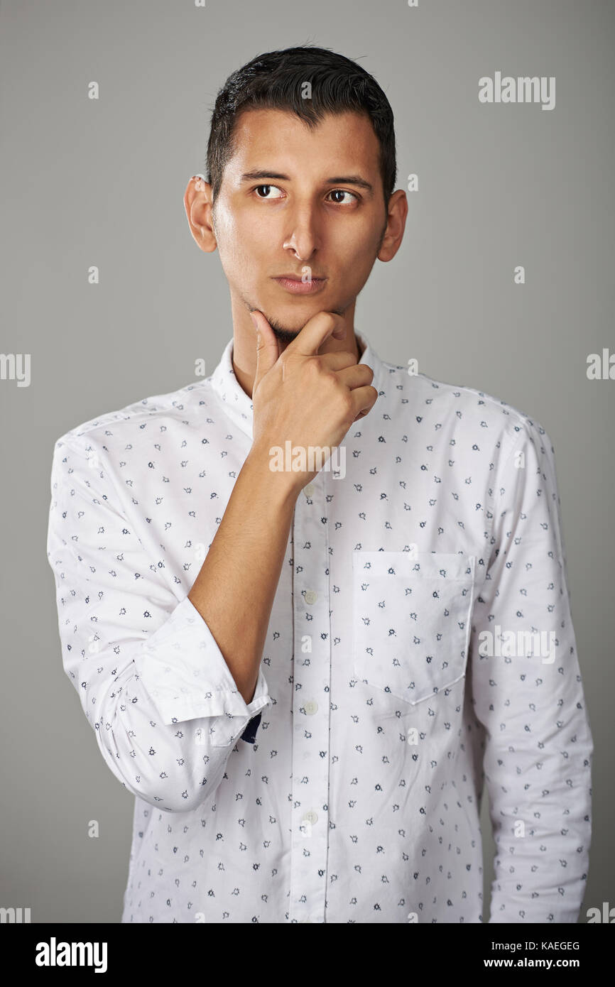 Man with hand on chin thinking about future Stock Photo - Alamy