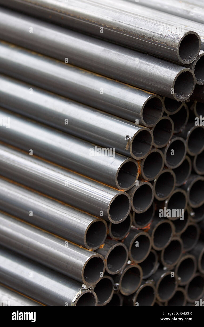 Metal profile pipe of round section in packs at the warehouse of metal ...