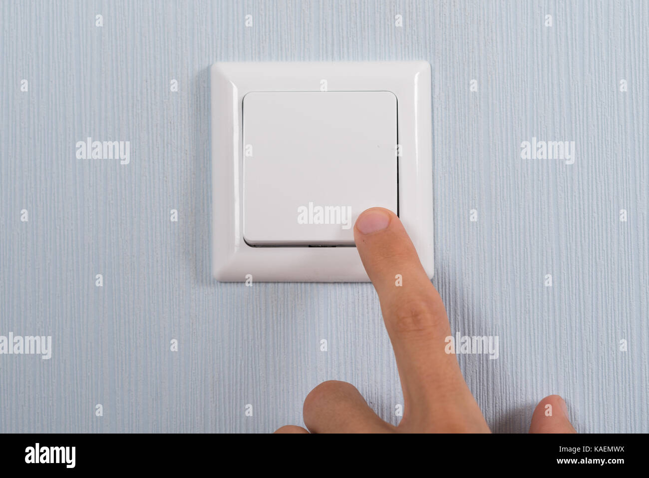 Close-up Of Hand Pressing White Switch On Wall Stock Photo - Alamy