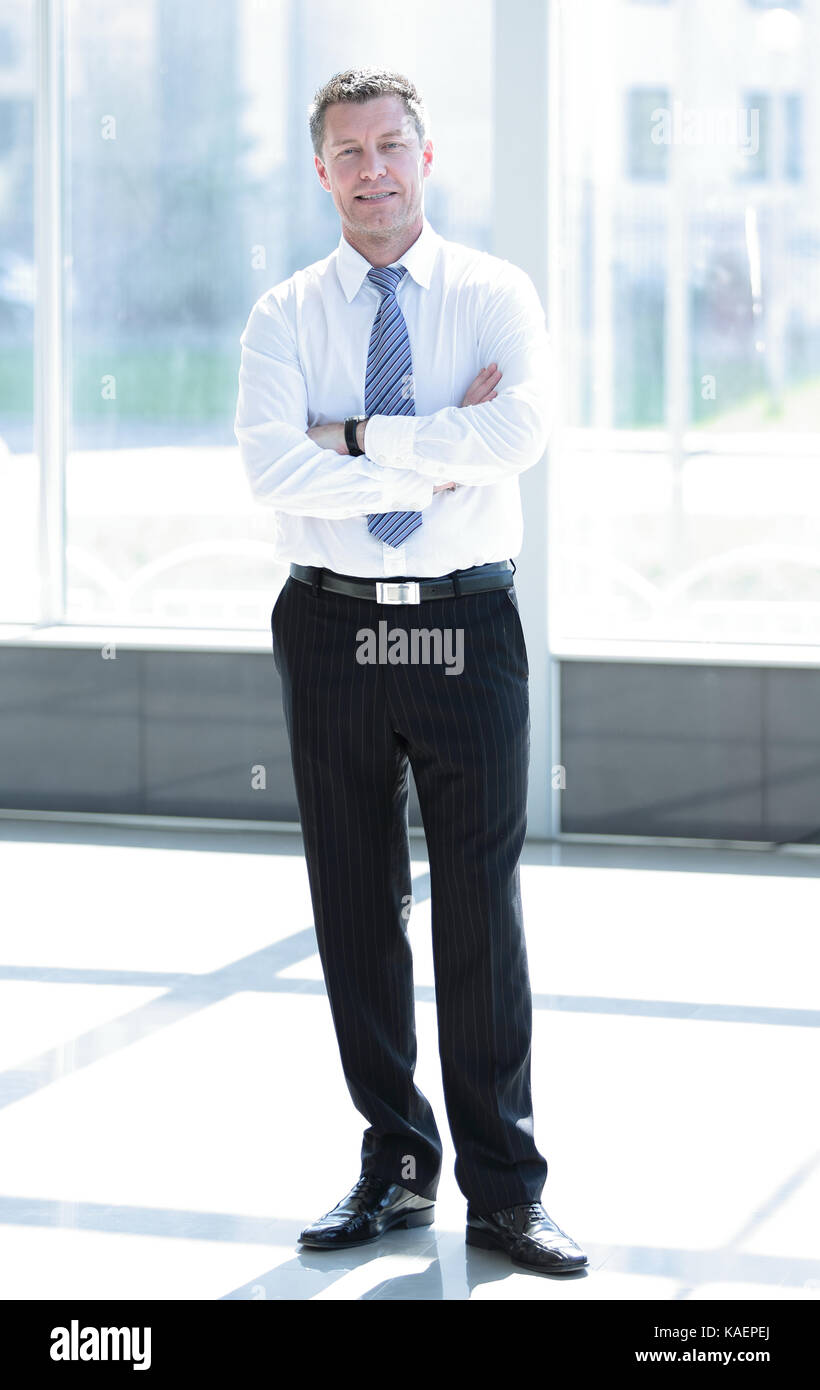 Full length image of serious business man which posing in studio Stock ...