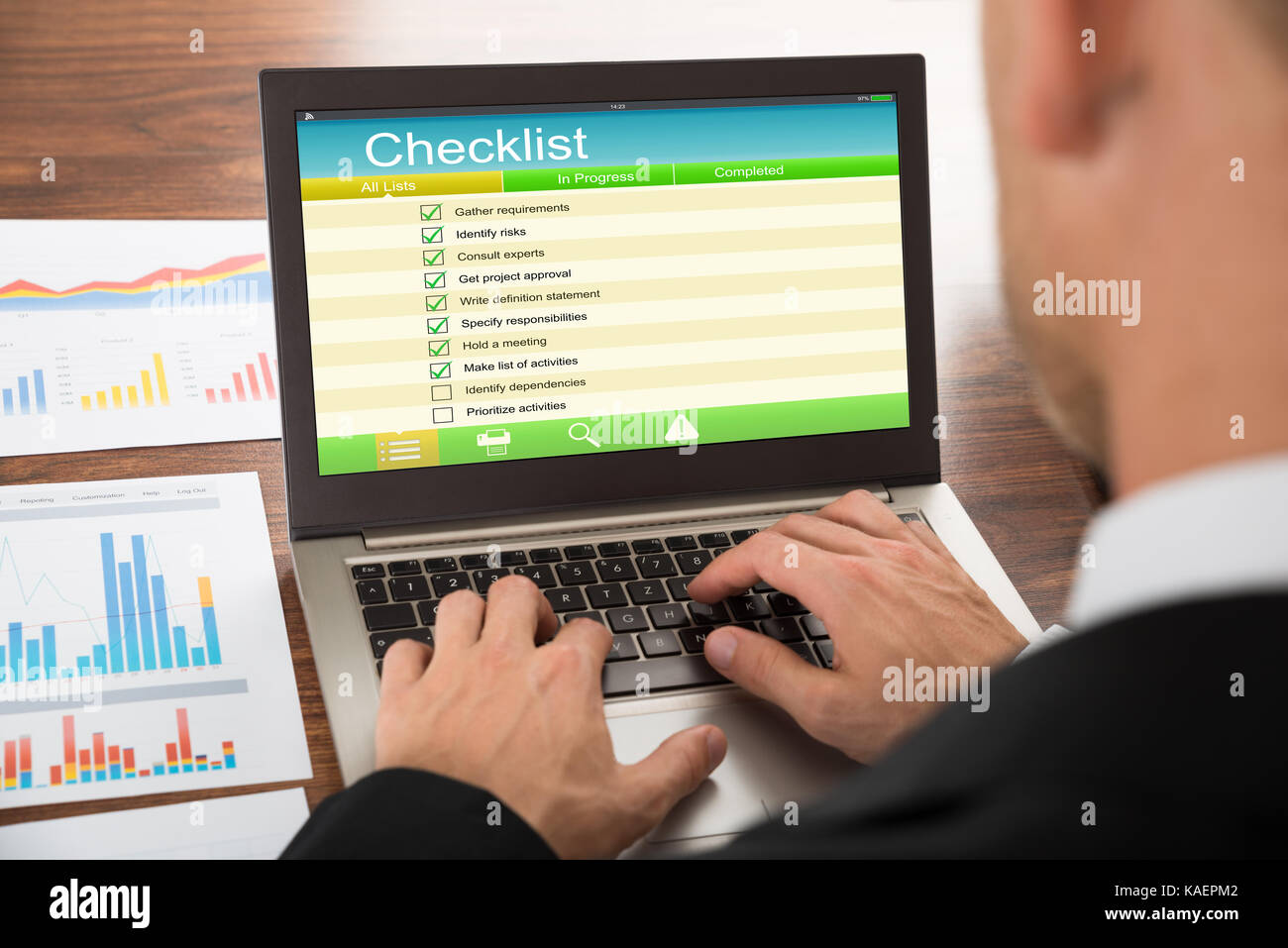 Close-up Of A Businessman Filling Checklist Form On Laptop Stock Photo ...