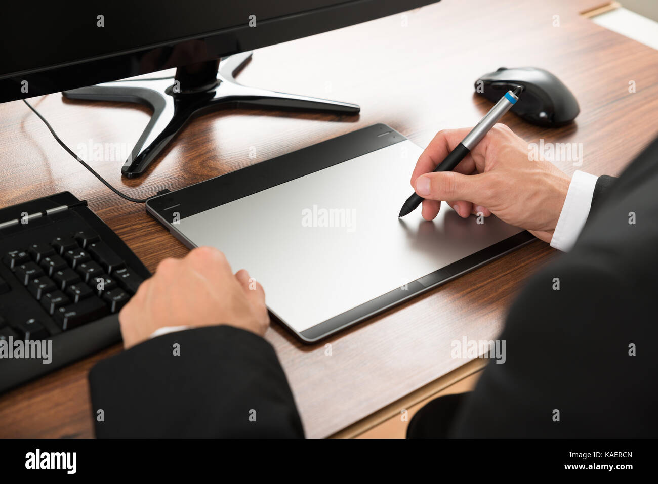 Man working desk office drawing tablet hi-res stock photography and ...
