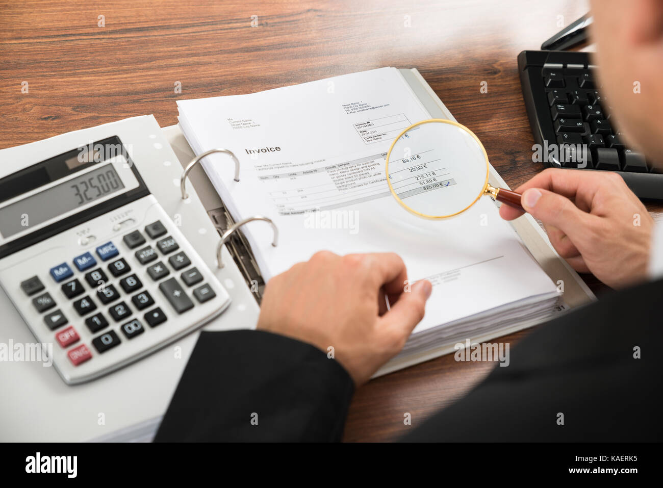 Close-up Businessman Looking At Invoice Through Magnifying Glass Stock ...
