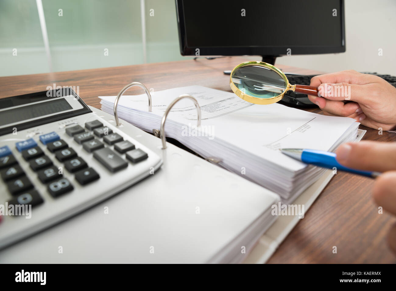 Close-up Person's Hand Holding Magnifying Glass Over Invoice Stock ...