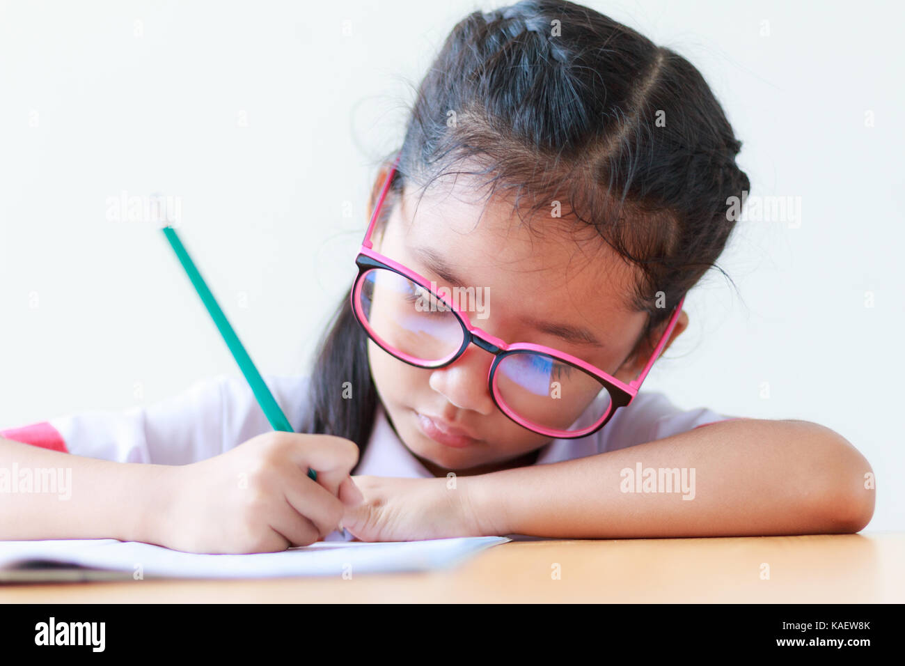 Students doing homework in asia hi-res stock photography and images - Alamy