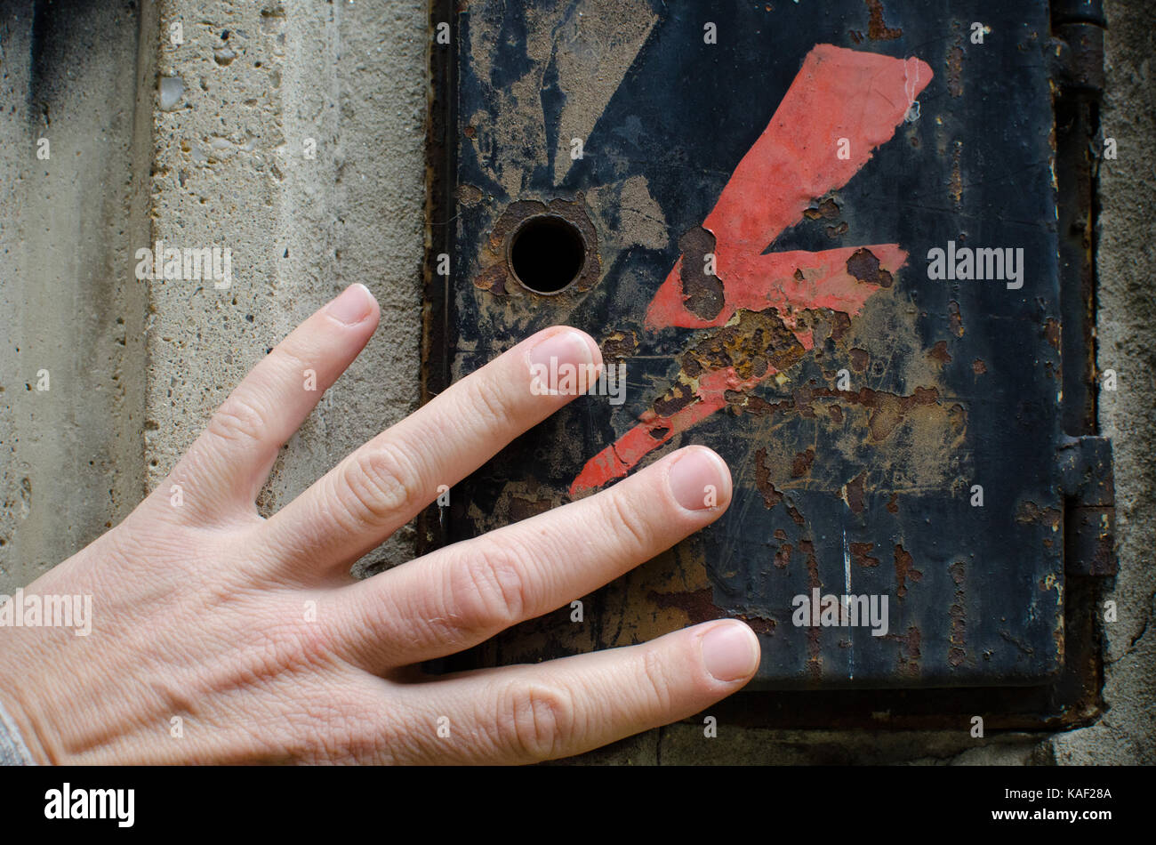 Danger Electrical Hazard High Voltage Sign with hand Stock Photo - Alamy