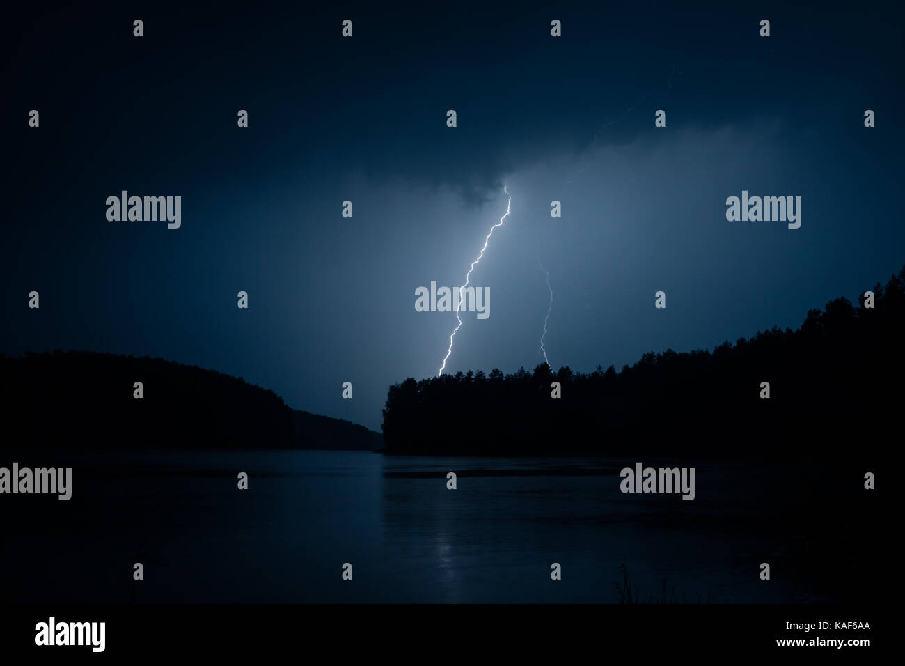Lightning storm on a lake Stock Photo - Alamy