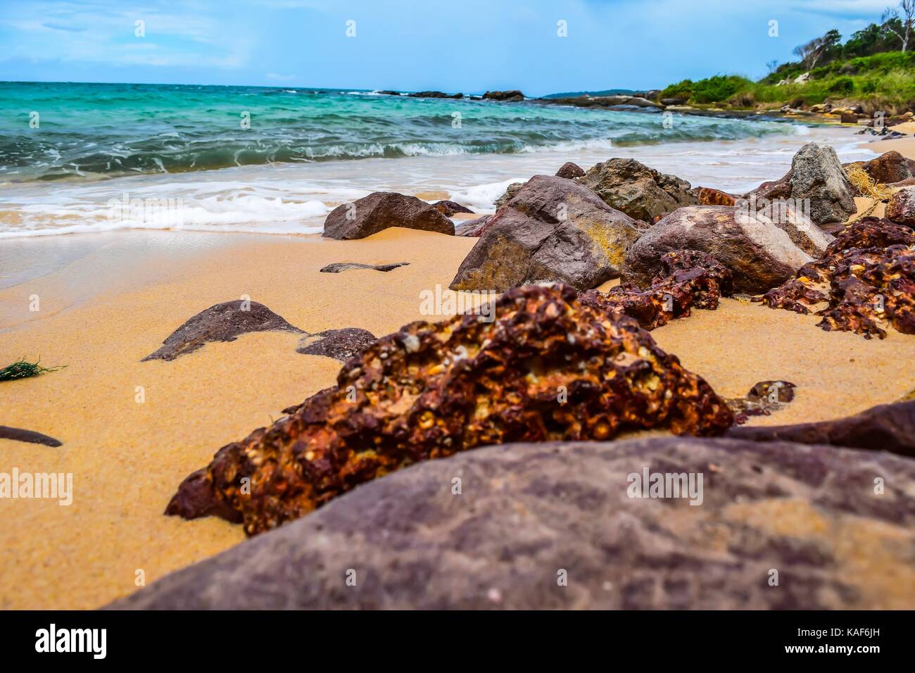 Sunrise over the sea. Stone on the foreground Stock Photo - Alamy