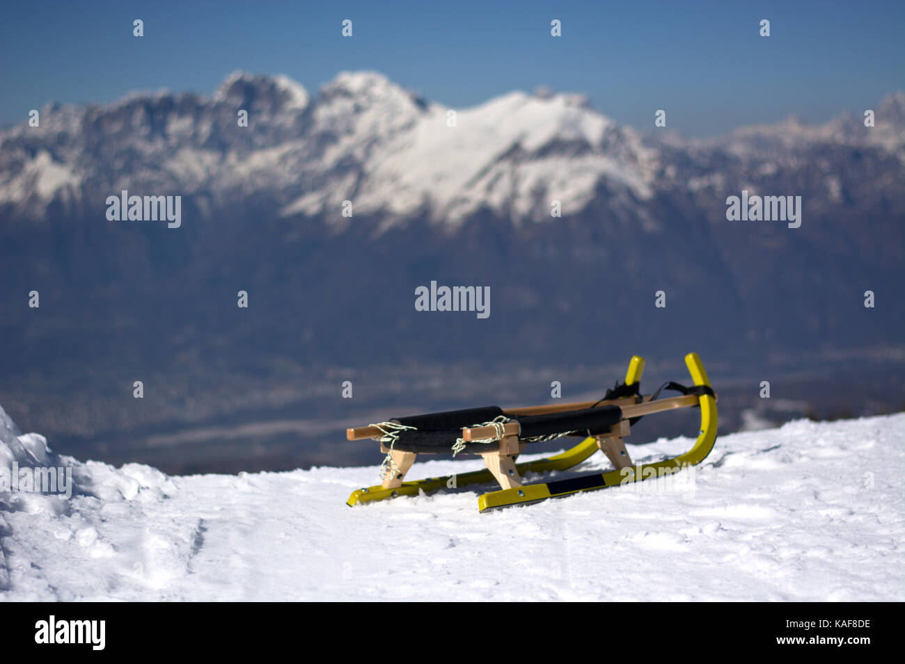 the sled in front of the snowy mountains Stock Photo - Alamy