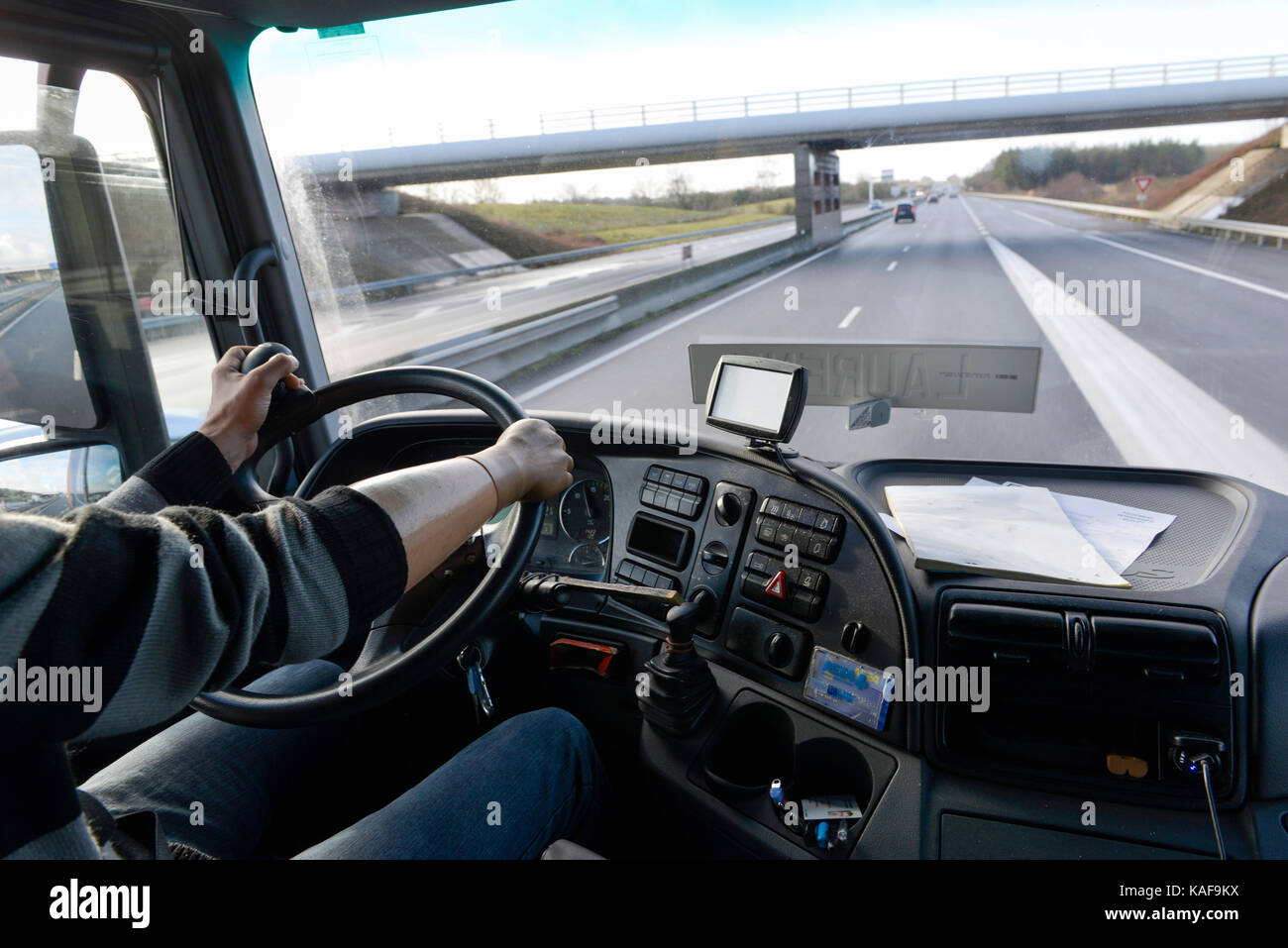 Disability, man driving a lorry with a right prosthetic hand and ...