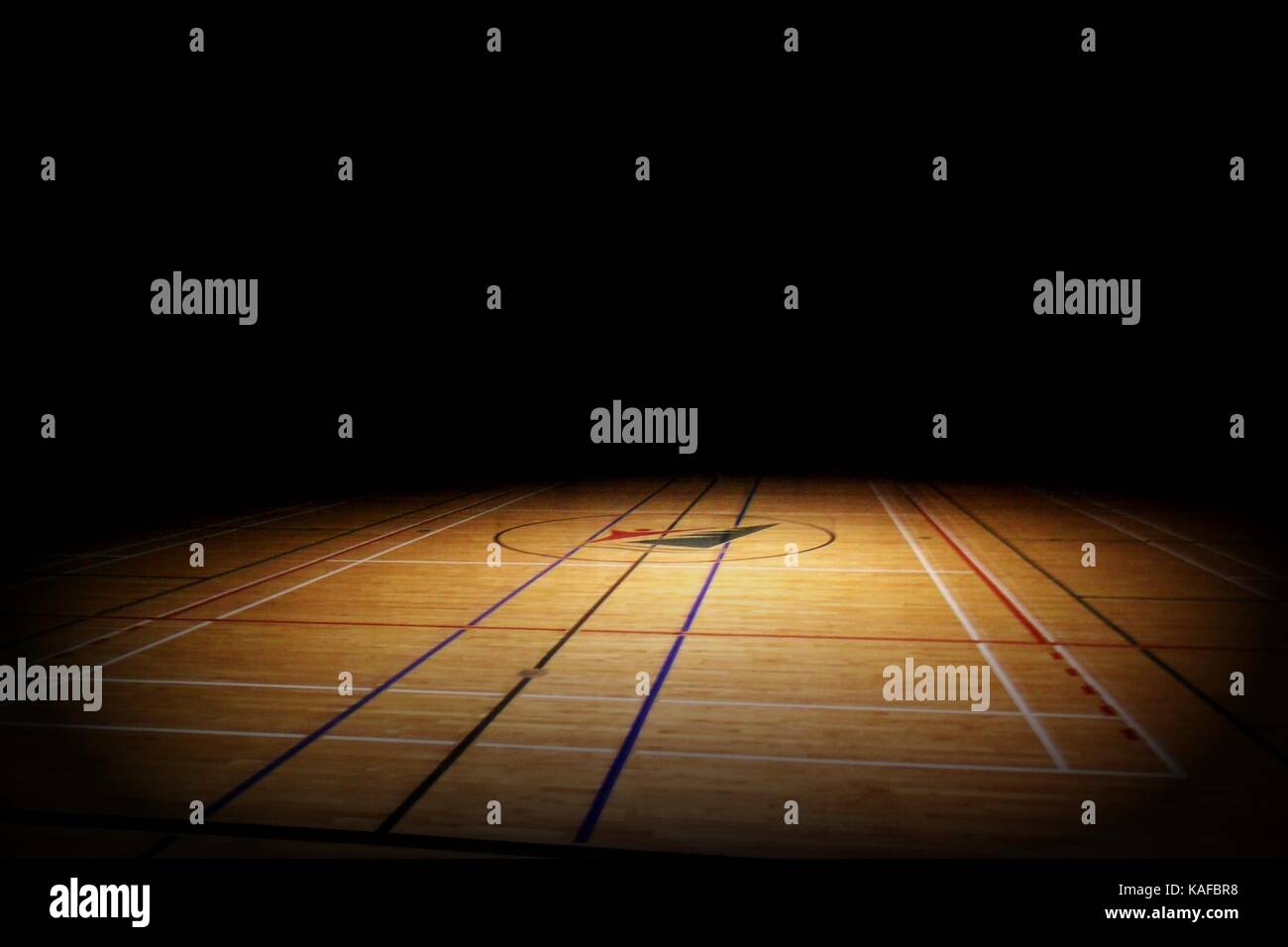 Spotlight in the center of a gym Stock Photo - Alamy