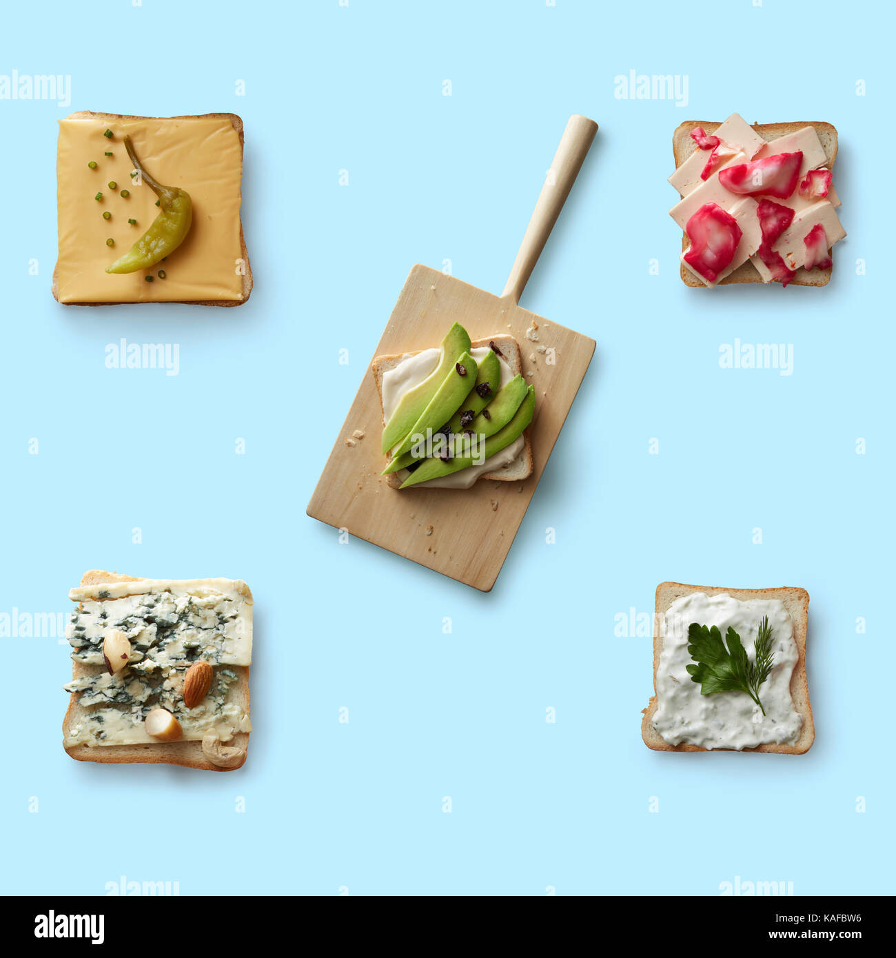 different sandwiches on a blue background Stock Photo - Alamy