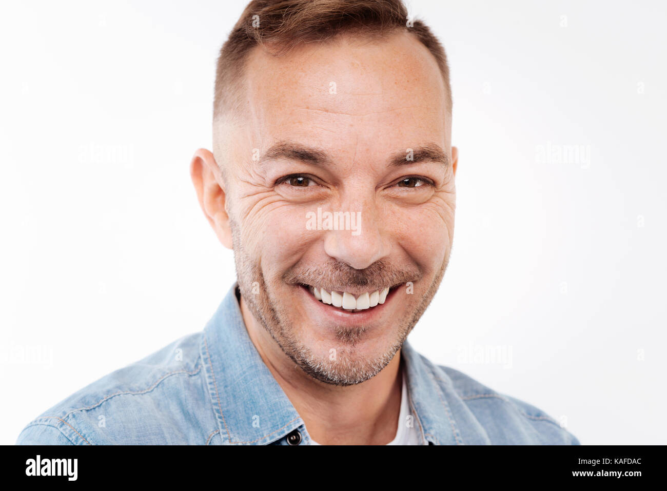 Close up of happy young man smiling Stock Photo - Alamy