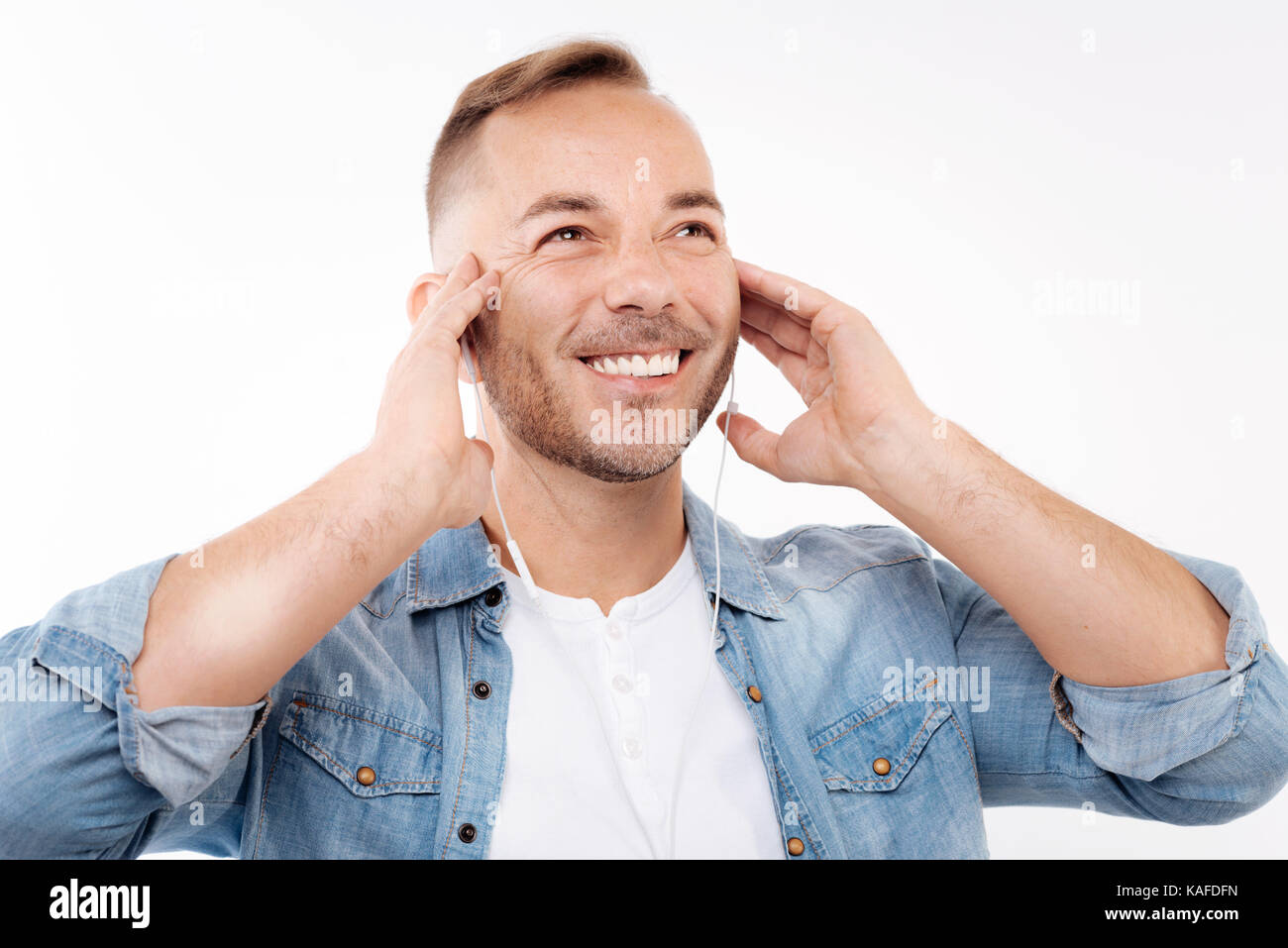Happy man enjoying the music in headphones Stock Photo - Alamy