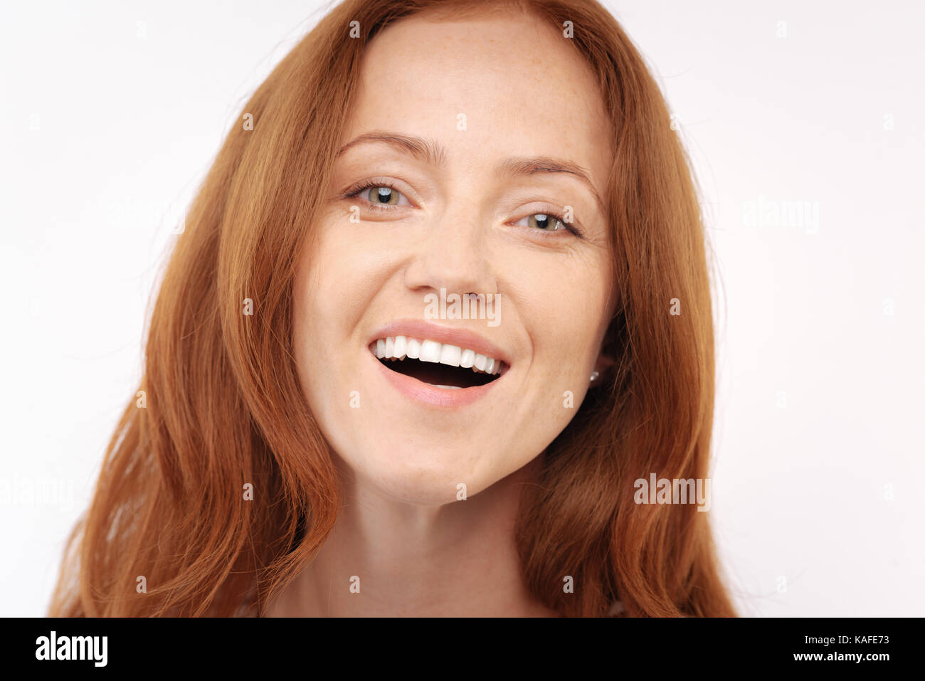 Portrait of a smiling ginger-haired woman Stock Photo - Alamy