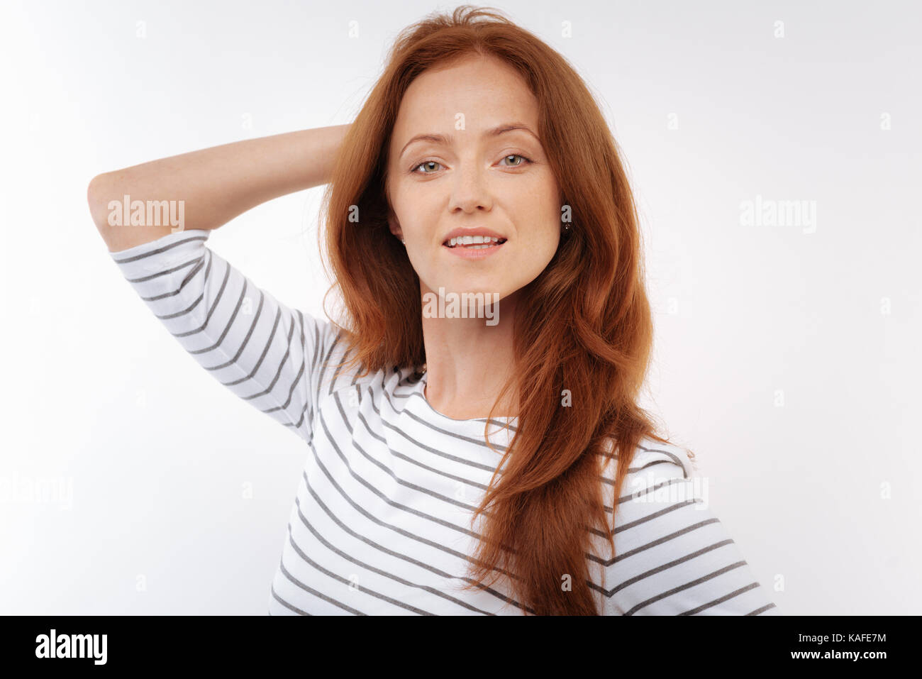 Ginger-haired woman posing on white background Stock Photo - Alamy