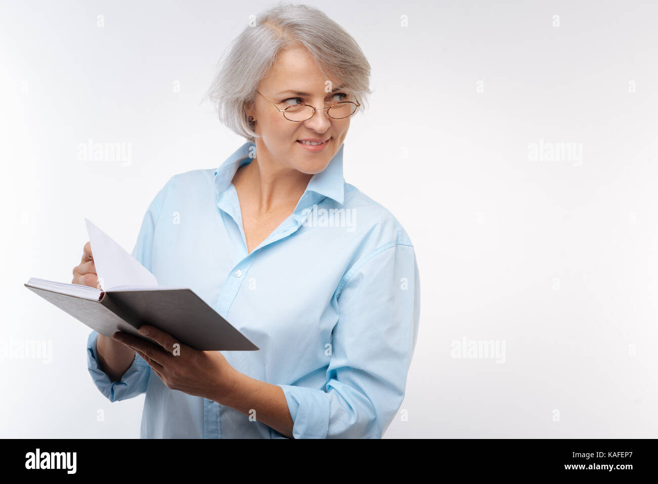 Charming senior woman reading a book Stock Photo - Alamy