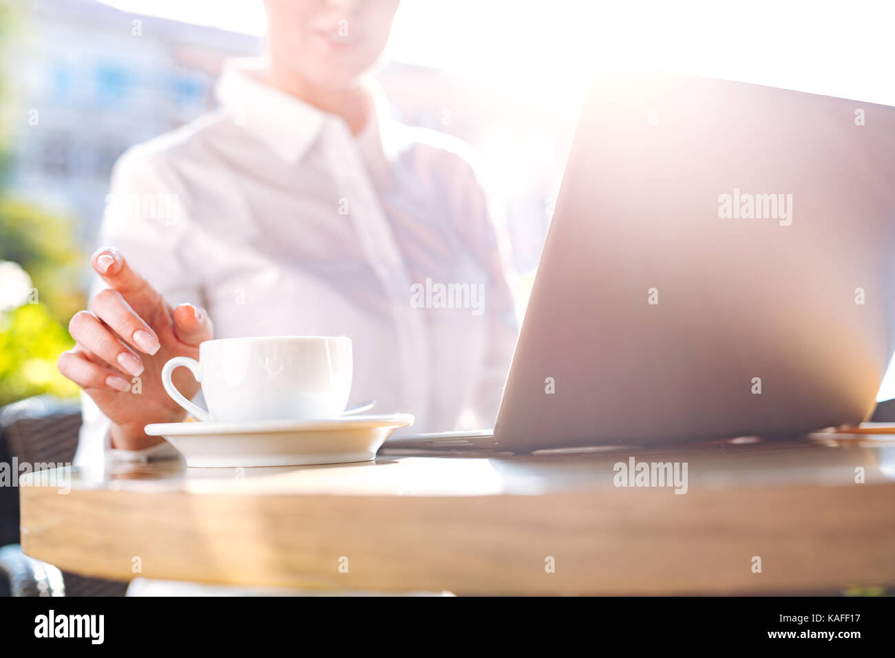 Neat female hand reaching for a cup of coffee in cafe Stock Photo - Alamy