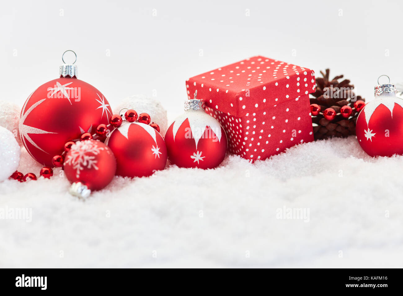 Red decoration with snow for christmas card Stock Photo - Alamy