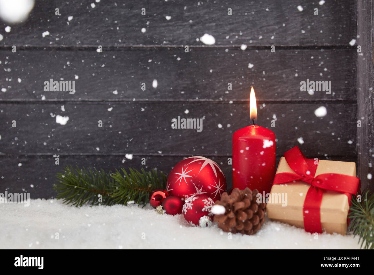 Candle and snow as christmas background for advent Stock Photo - Alamy