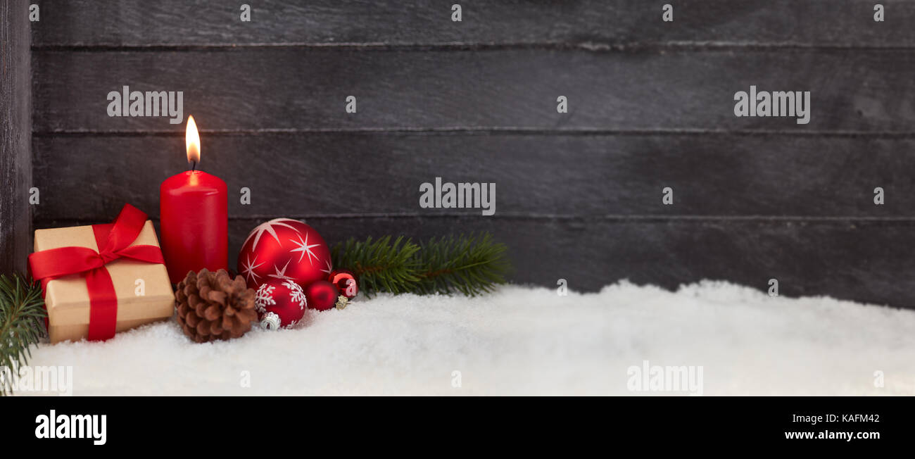 Christmas panorama background with red candle and gift Stock Photo - Alamy