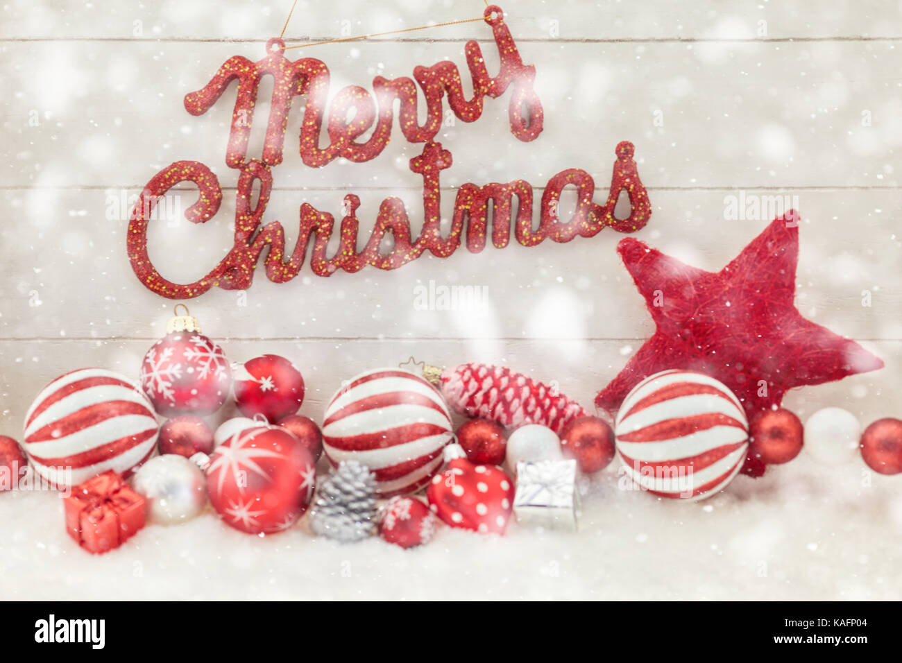 Merry Christmas text with snow and decoration for card Stock Photo - Alamy