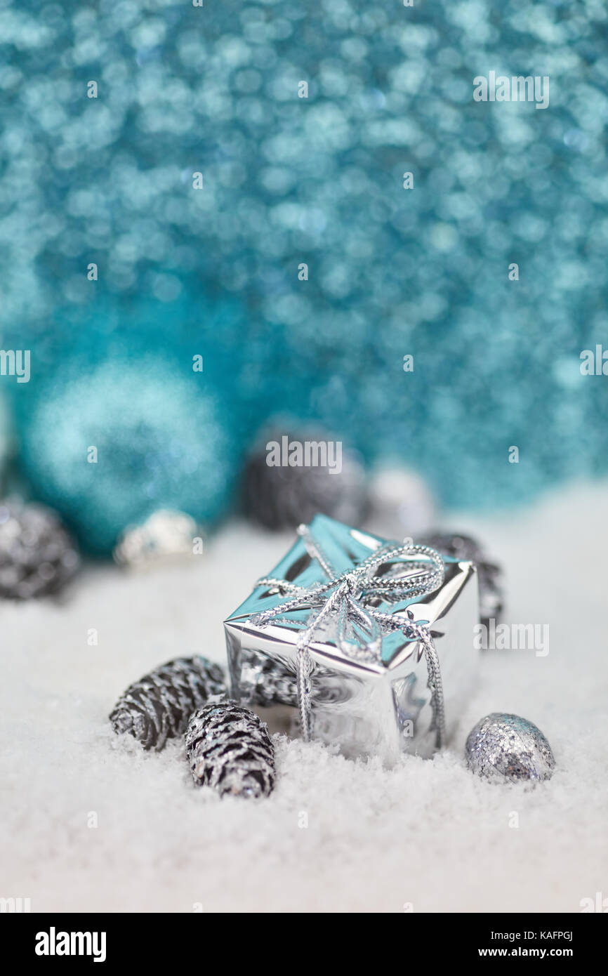 Christmas present on the snow as card background Stock Photo - Alamy