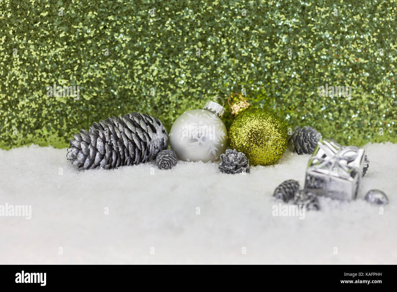 Christmas background in green with two baubles and present Stock Photo ...