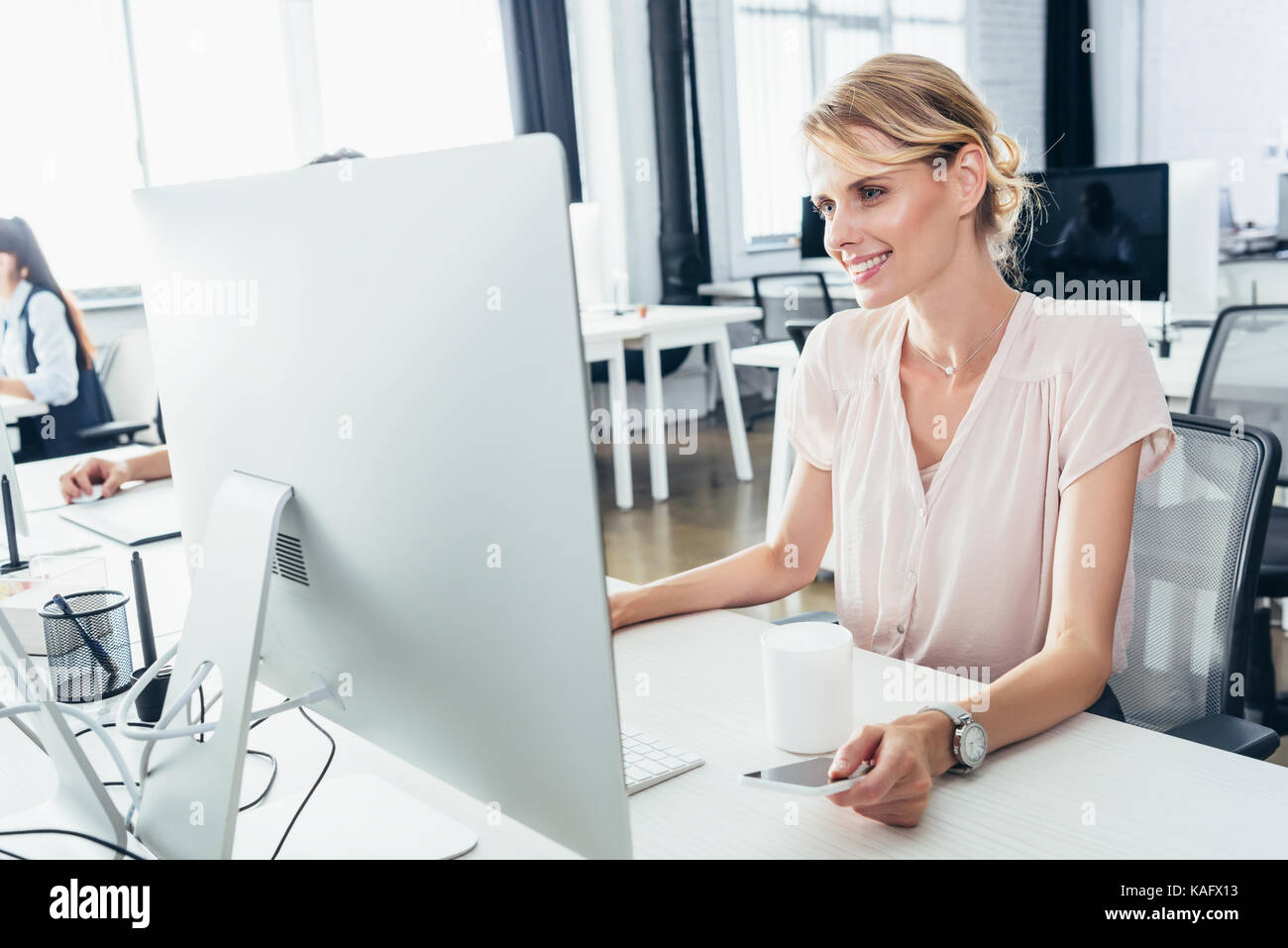 businesswoman using desktop computer Stock Photo - Alamy