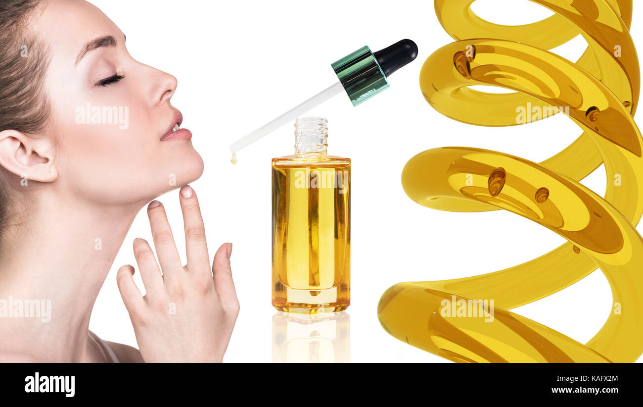 Cosmetic oil applying on face of young woman Stock Photo - Alamy