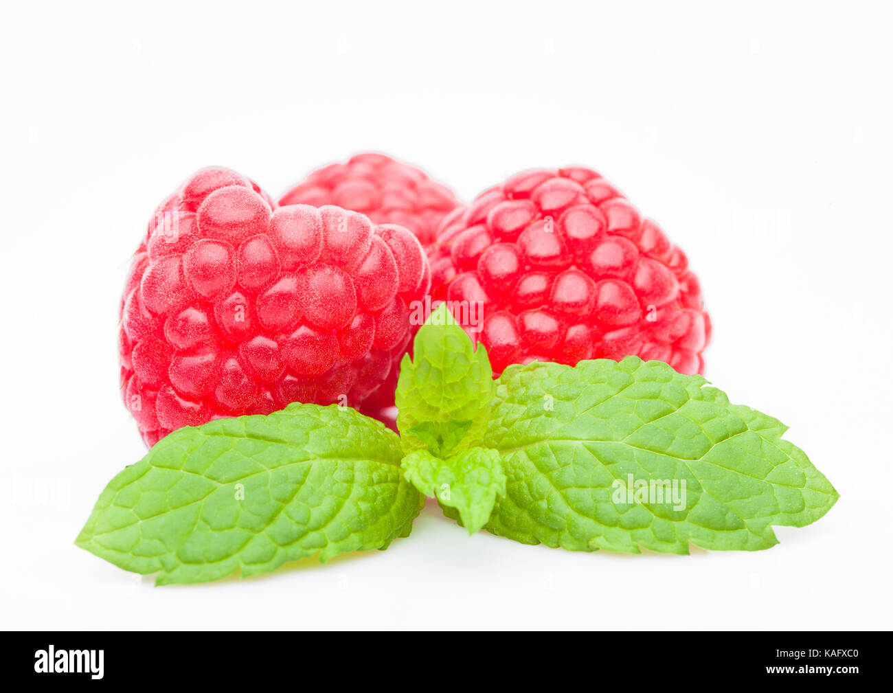 Fresh healthy red raspberries with mint leaf on white background Stock ...