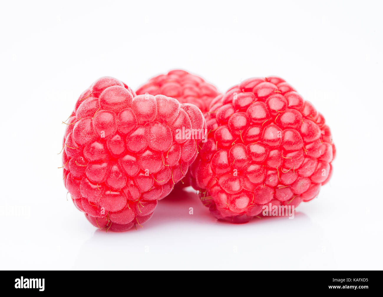 raspberries with mint leaf on white background Stock Photo - Alamy