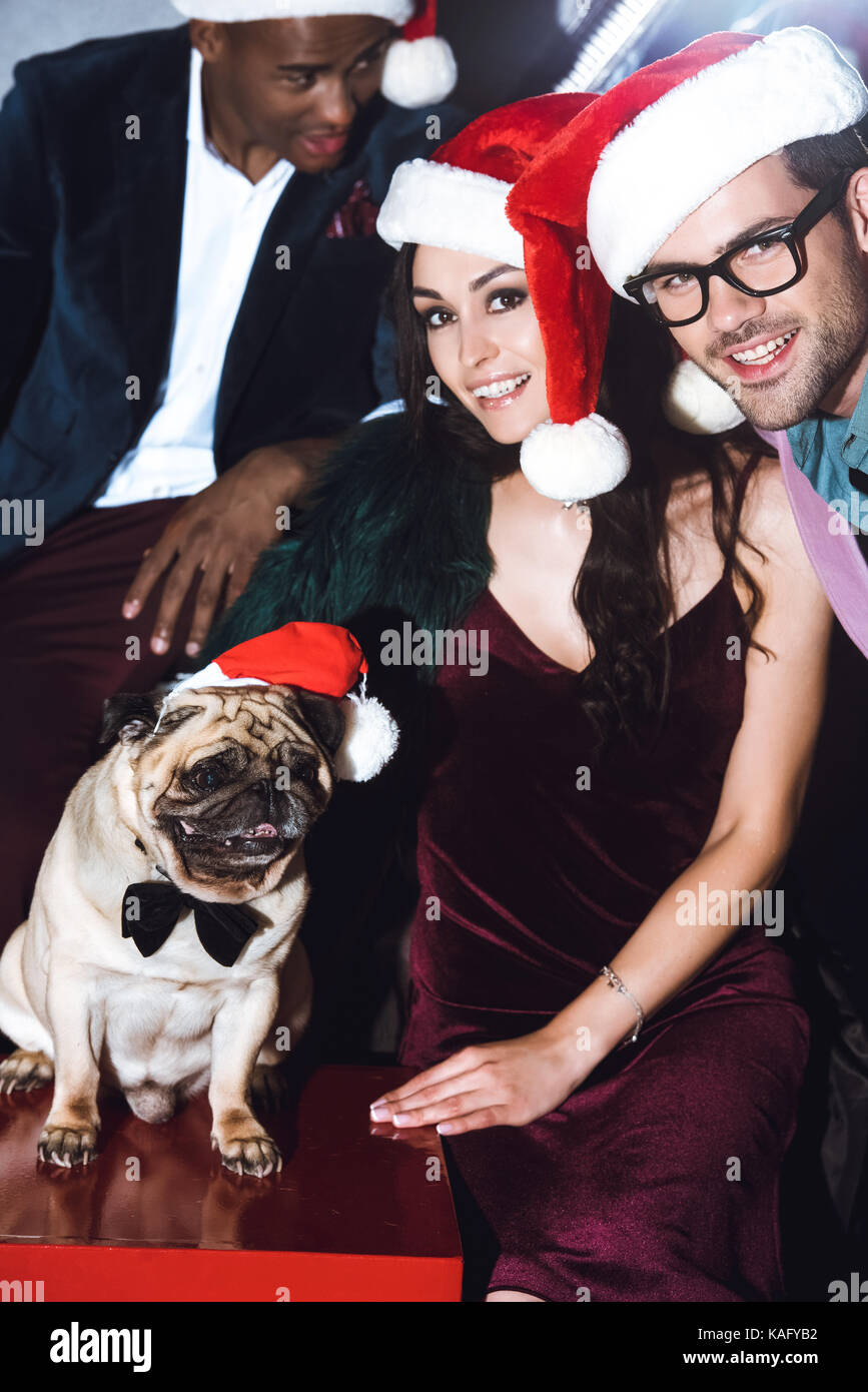 Group happy friends santa hi-res stock photography and images - Alamy