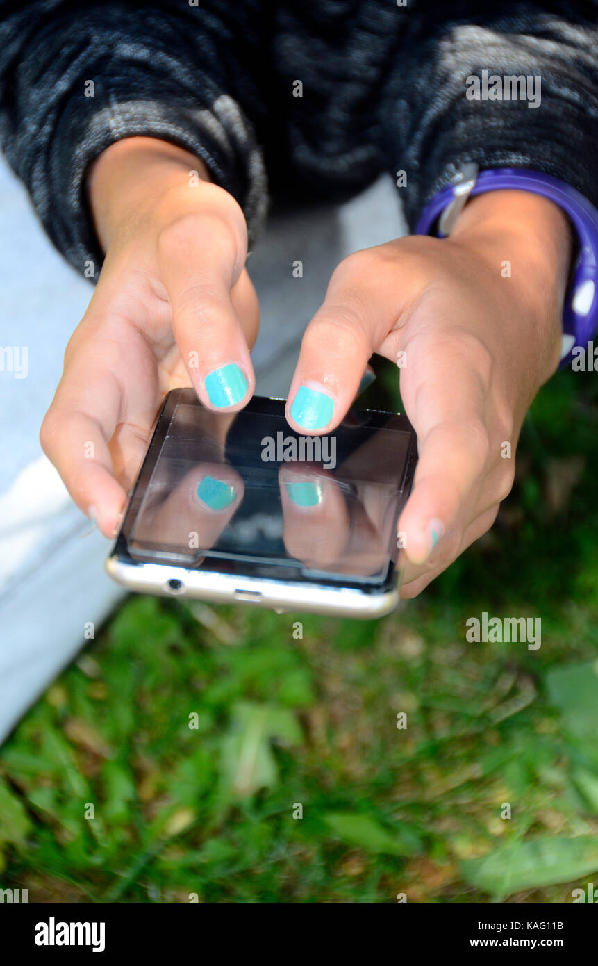 Smartphone, teen's hand texting on her phone, focus on fingers Stock ...