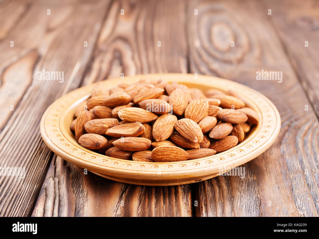 fried almond on plate and on a table Stock Photo - Alamy