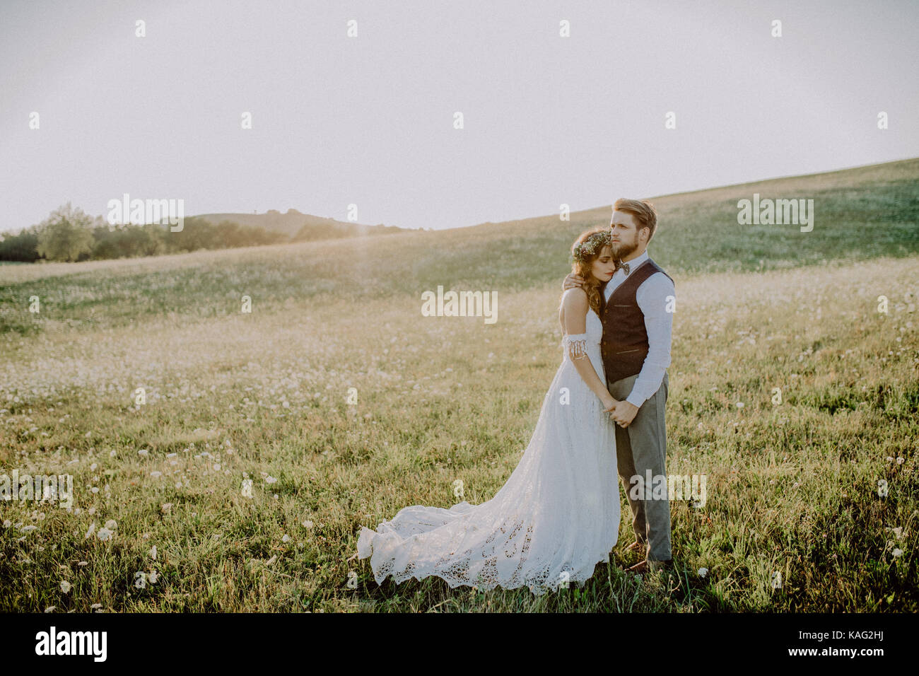 Beautiful bride and groom in green nature Stock Photo - Alamy