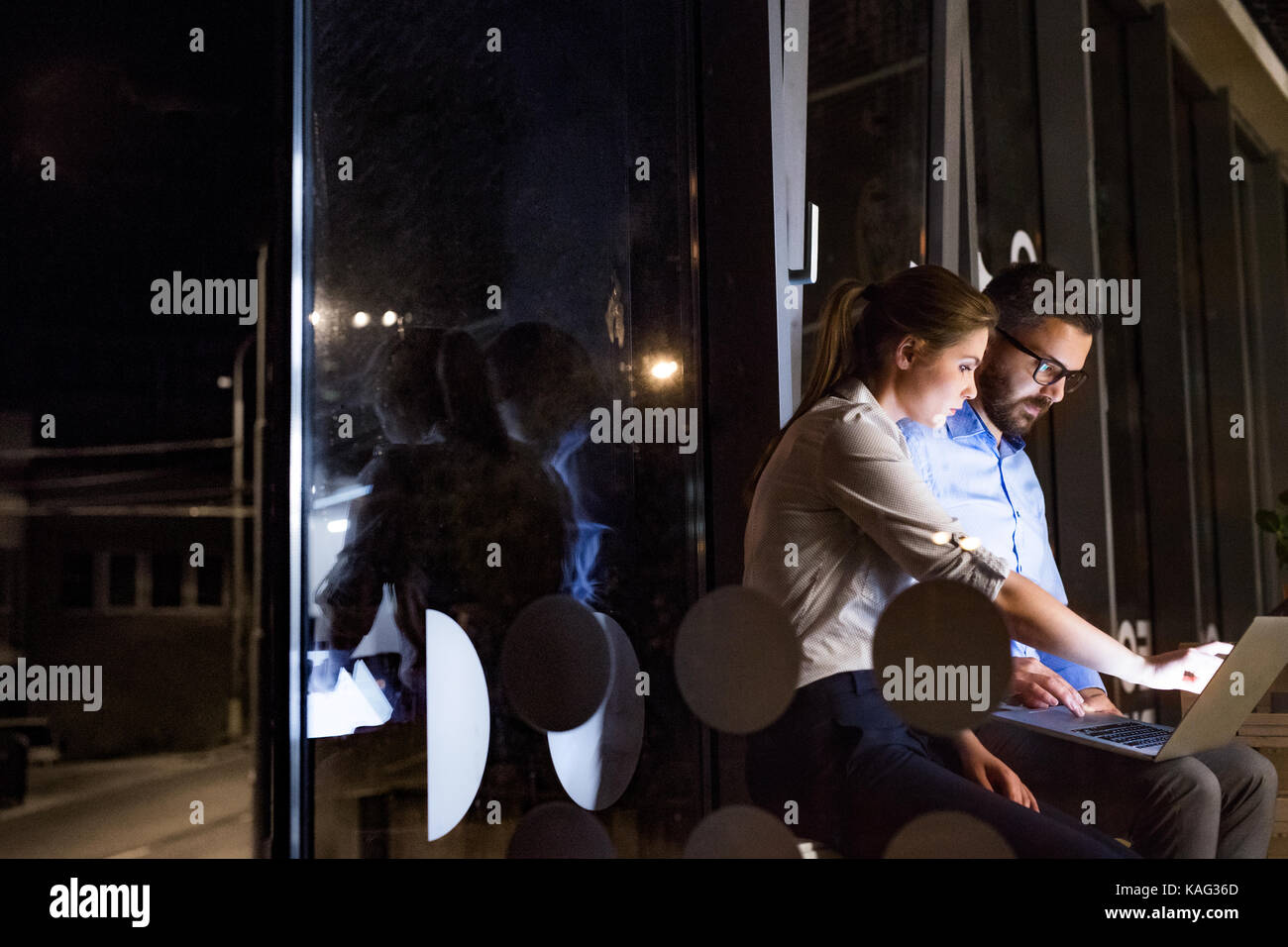 Businesspeople in the office at night working late Stock Photo - Alamy