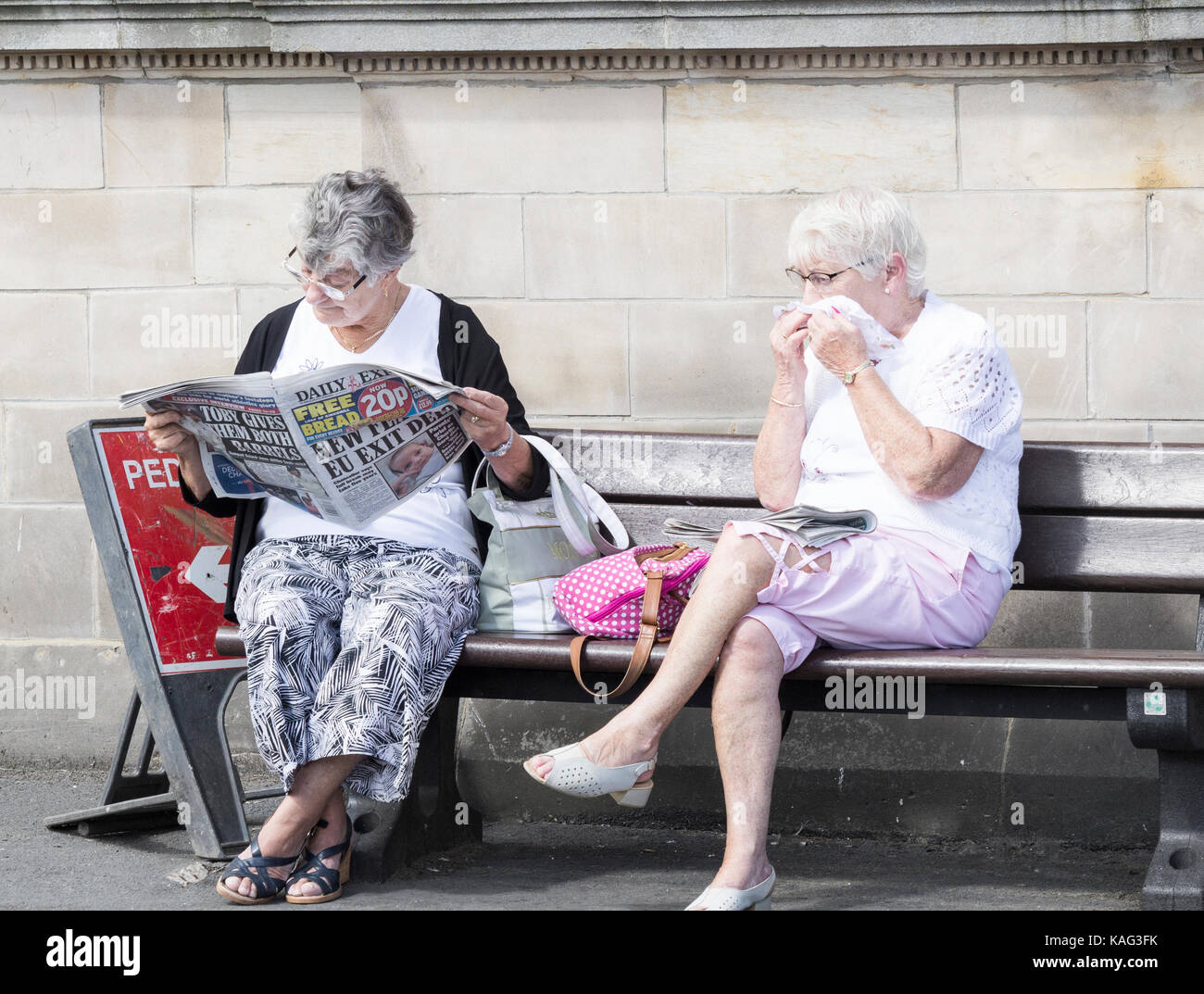 Elderly person reading daily express hi-res stock photography and ...