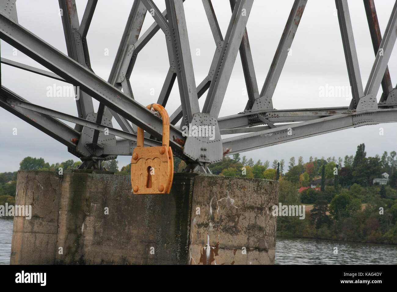 wooden lock hanging under our bridge Stock Photo - Alamy