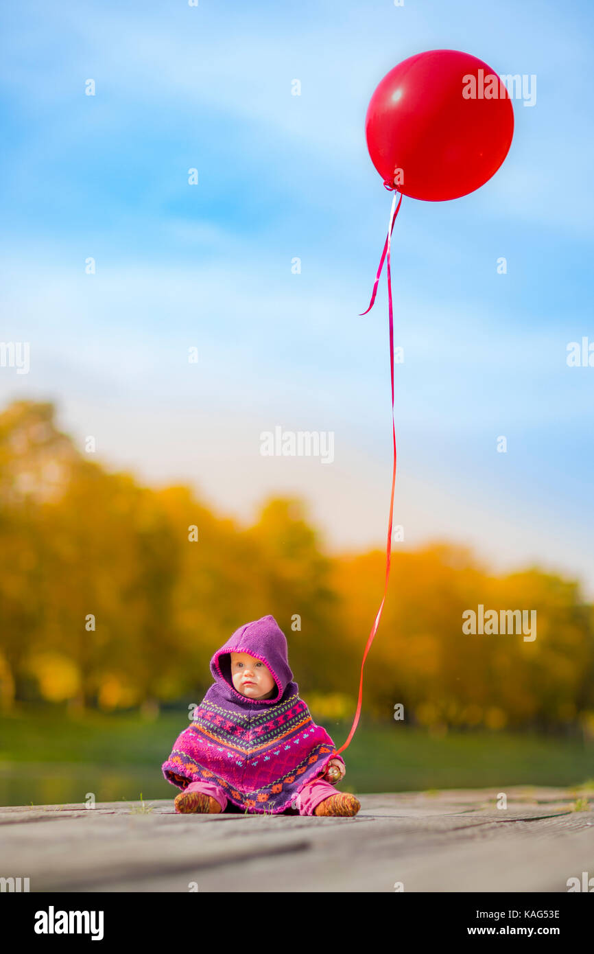 cute happy child baby playing outside in autumn fall sun Stock Photo ...