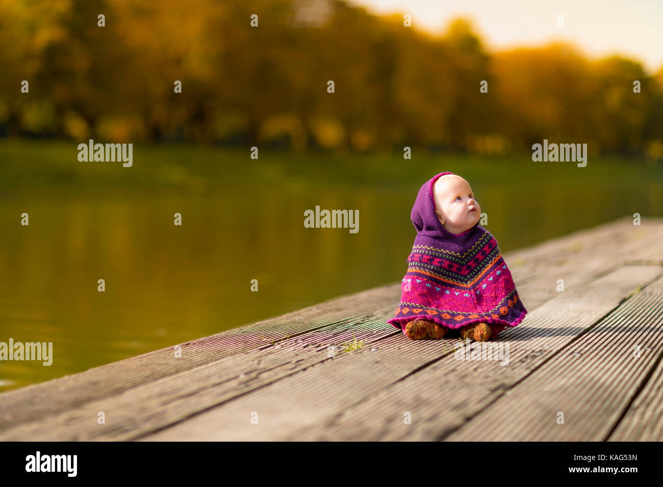 cute happy child baby playing outside in autumn fall sun Stock Photo ...