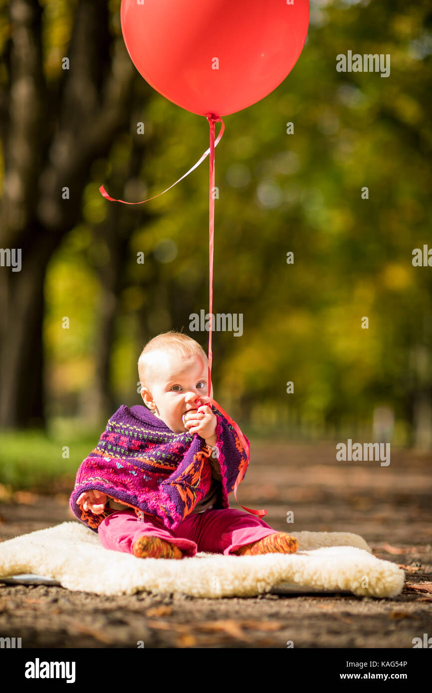 cute happy child baby playing outside in autumn fall sun Stock Photo ...
