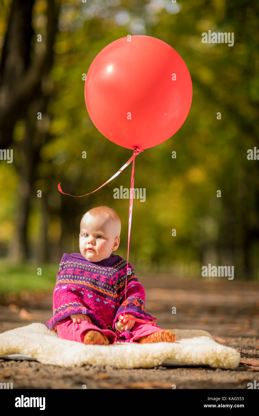 cute happy child baby playing outside in autumn fall sun Stock Photo ...