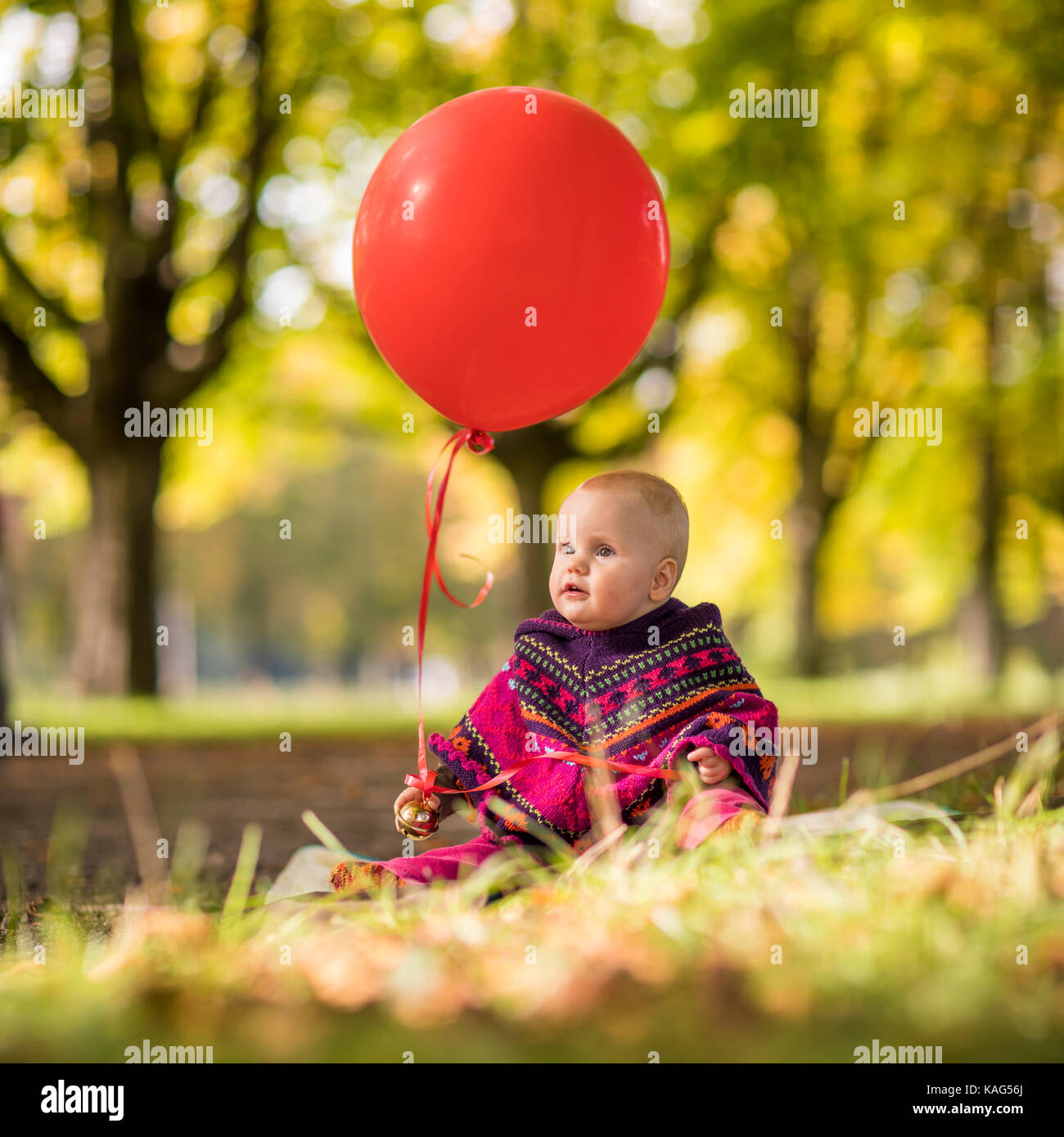 cute happy child baby playing outside in autumn fall sun Stock Photo ...